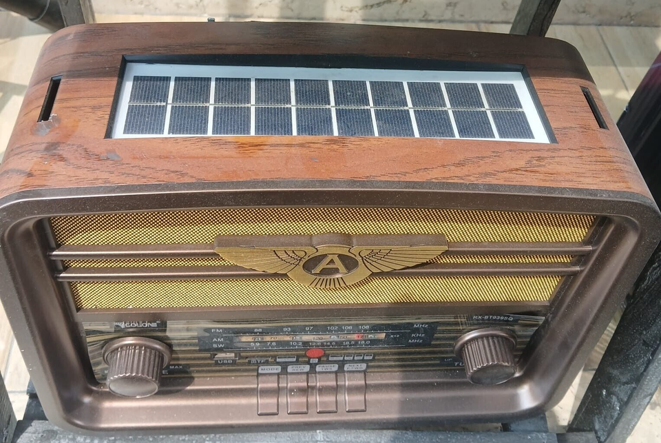 Antique portable radio, modern manufacture, battery operated Or solar ...