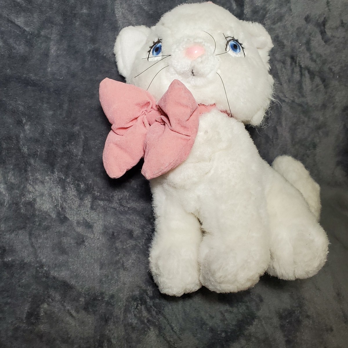 Fluffy White Kitten With A Bow
