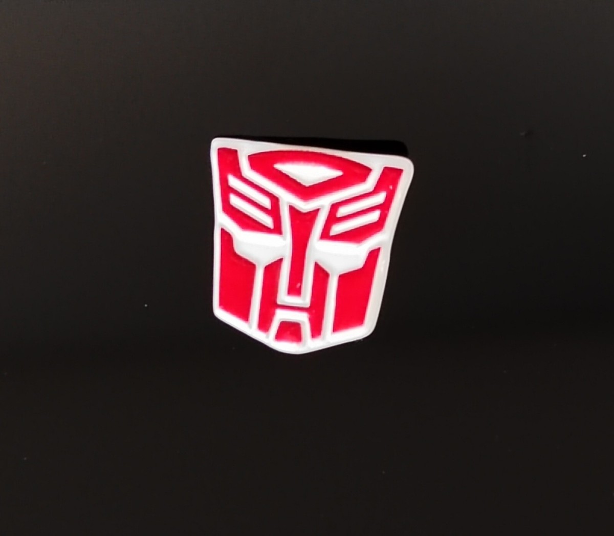 Autobot Symbol Transformers Autobot Logo Faux Taper – Jewelry Brands