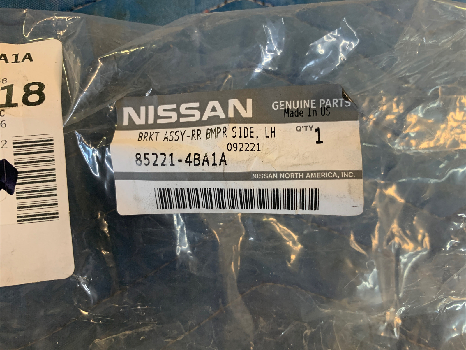 NEW Nissan BRKT ASSY-RR BMPR SIDE, LH OEM 85221-4BA1A | eBay