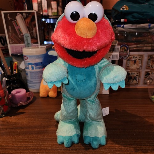 Sesame Street Dino Stomp Elmo 13-Inch Plush Stuffed Animal Sings ...