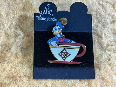 V12-61 DISNEY PIN - DONALD DUCK ON THE TEA CUP RIDE LOOKING NAUSEOUS ...