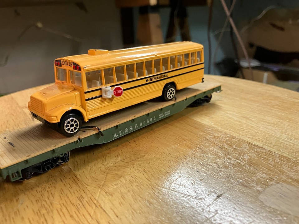 UNBRANDED NAME Ho school bus on 50 ft flat car w/ metal wheels and #5 ...