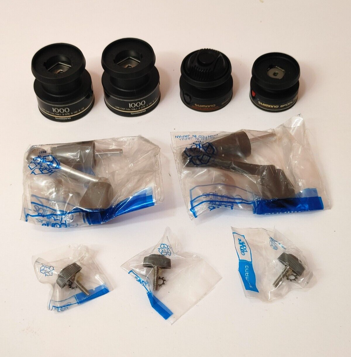 Shimano Spinning Reel Spare Handle Screw Caps and Spools Lot | eBay