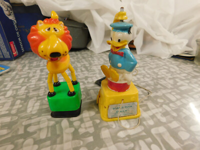 Donald Duck "Spinikin"& Lion "push puppet" | eBay