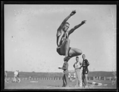 Athlete Adrian Button performing a long jump, NSW, 13 March 1934 Old ...