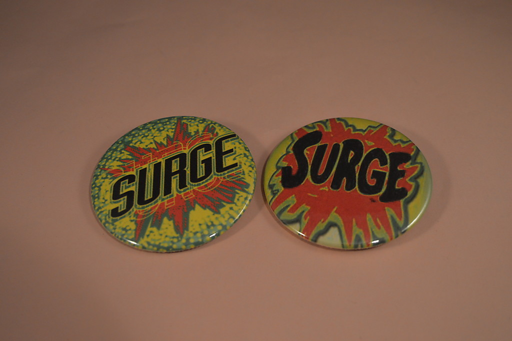 Lot of 2 "SURGE" SODA BUTTONS pins pinbacks 2 1/4" badges Large COCA ...