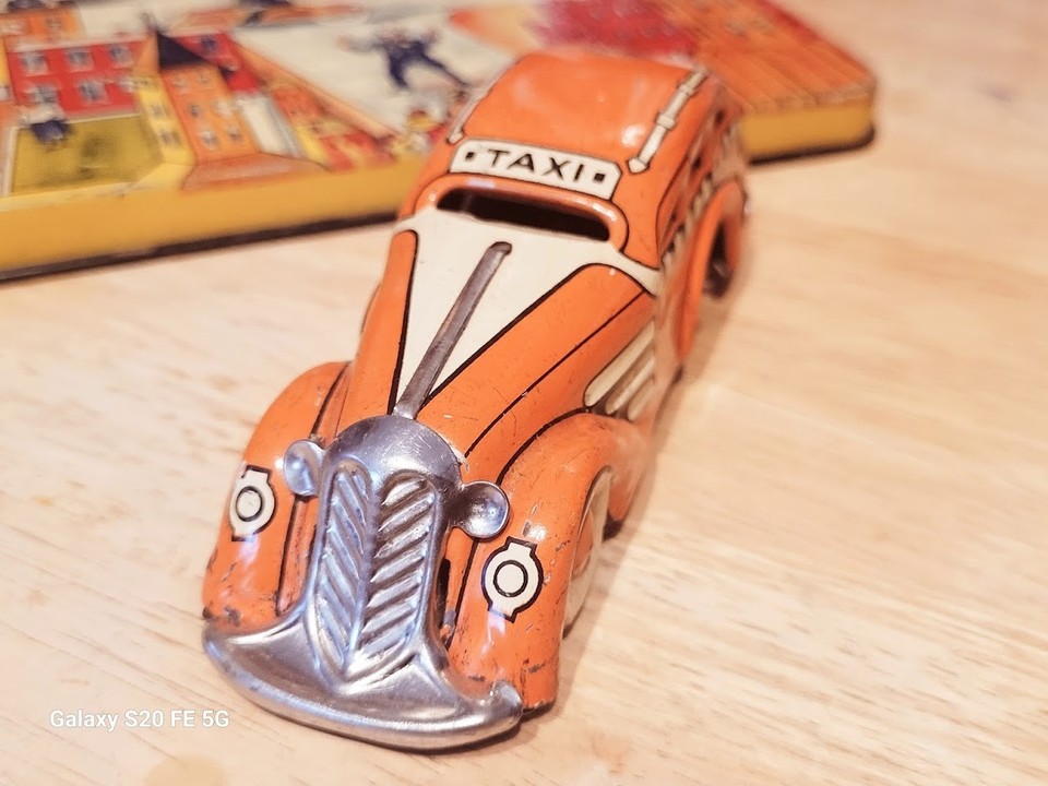VINTAGE 1930'S MARX TIN LITHO ORANGE WIND UP TRICKY TAXI with TIN BUSY ...