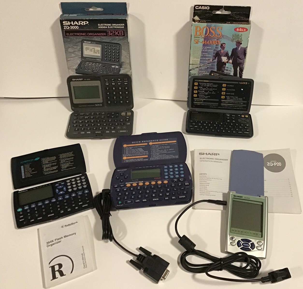 Lot of 5 electronic & flash Memory organizers - 3 Sharpe, Casio & Radio ...