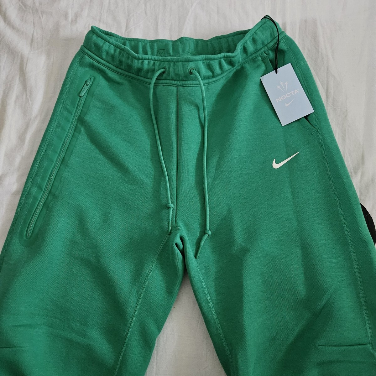 Nike X Nocta Tech Fleece Open Hem Pant Stadium Green FD8460 Nike X Nocta Tech Fleece Open Hem Pant Stadium Green FD8460