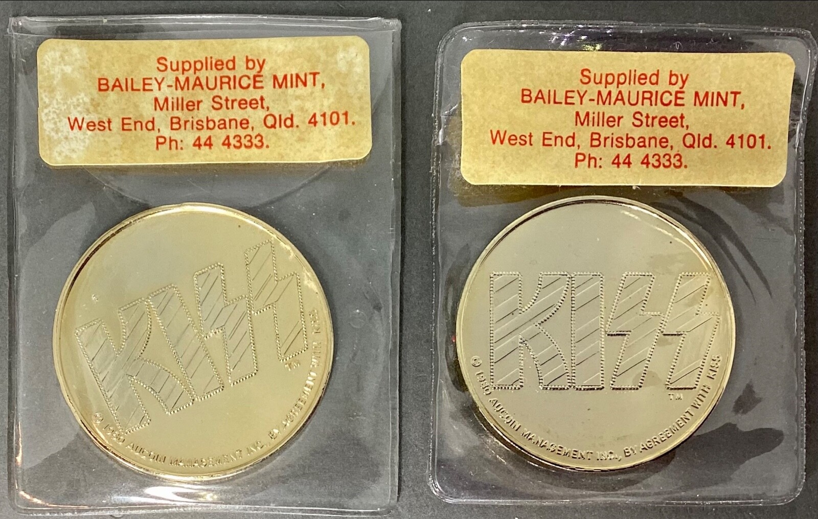 Package of 4 different KISS coins - 2 variations 1980 Oz + red Mardi ...