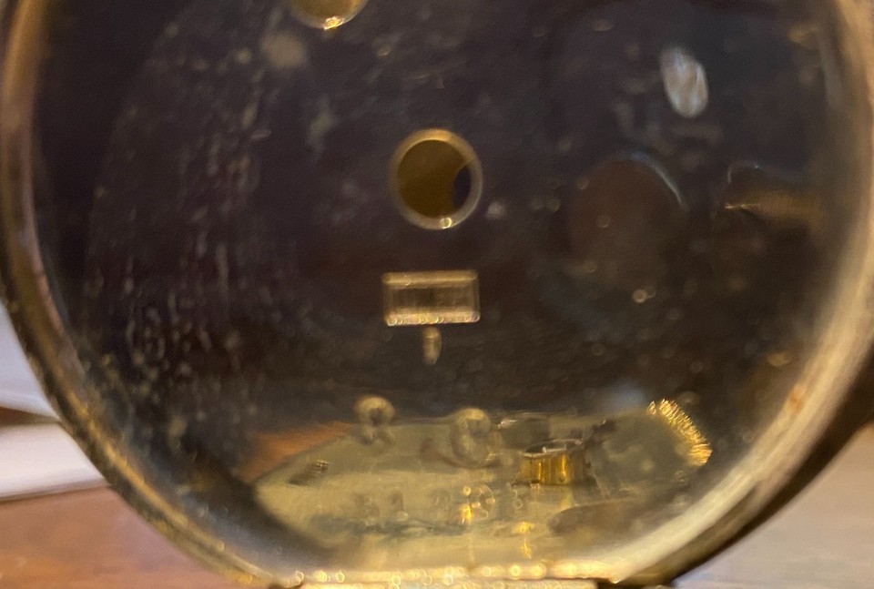 Silver pocket watch in a carved traveling stand Possibly Black Forest ...