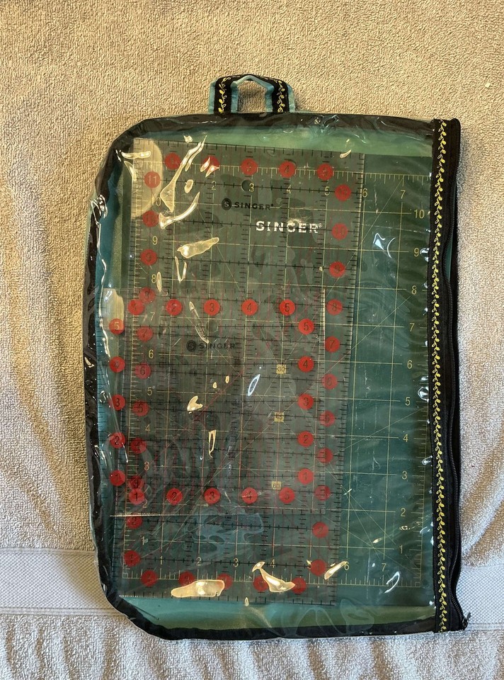 Set of Singer branded quilting rulers and cutting mat, with carrying ...