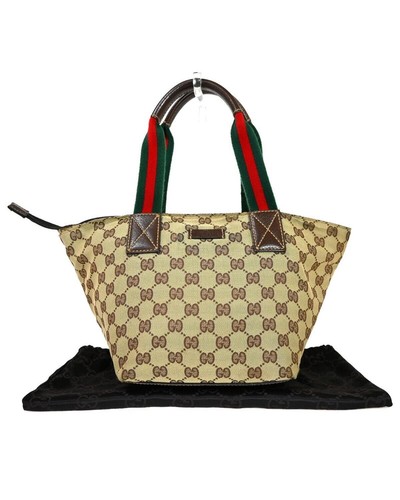 Pre Loved Gucci Beige Canvas Trapezoid Handbag with Signature Pattern ...