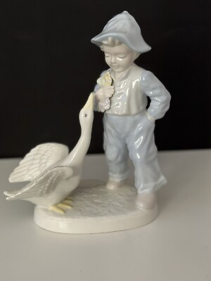 a beautiful piece of porcelain is a boy with a duck | eBay