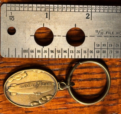 VINTAGE GOODYEAR BLIMP POSTAGE GUARANTEED KEYCHAIN TIRE RUBBER ...
