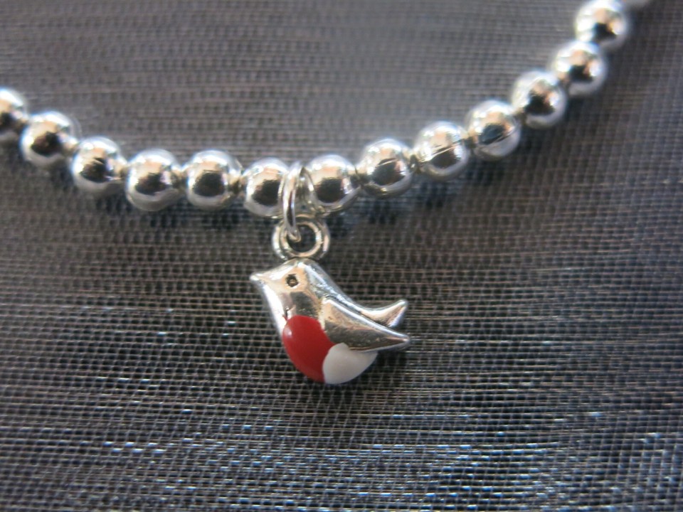 silver plated beaded bracelet with small red/white crest robin charm ...