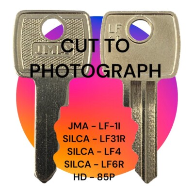 A PAIR OF SILCA JMA HD TIMPSONS KEY CUT TO PHOTOGRAPH LOCKER DESK ...