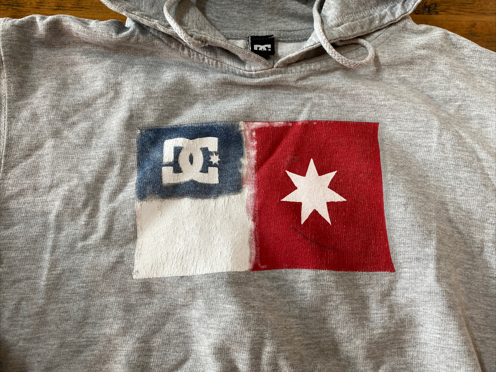 DC Gray with Red White & Blue Logo Flag Pullover Hood… - Gem