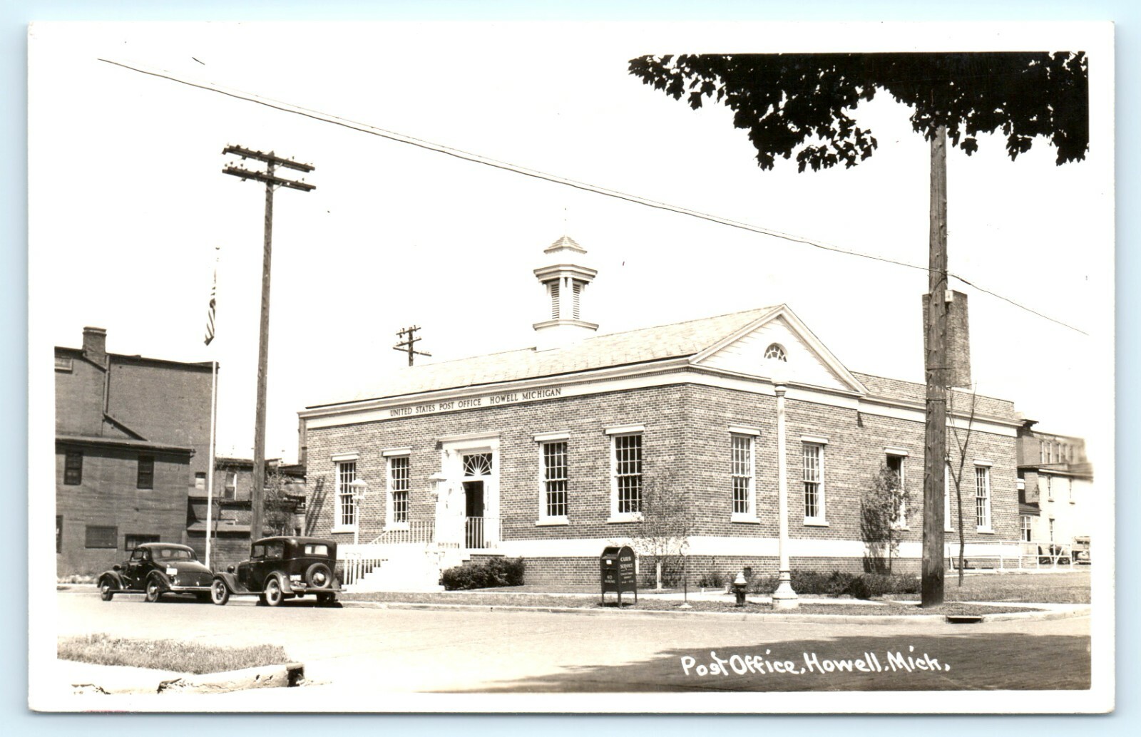 POSTCARD RPPC Post Office Howell Michigan Old Automobiles Flag 1940's ...