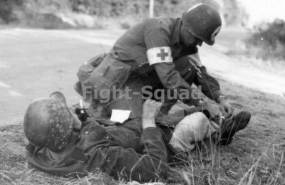 wW2 Picture Photo 1944 American medic helping a wounded Waffen soldier ...