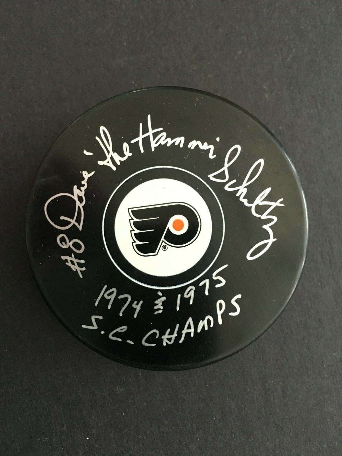 DAVE SCHULTZ AUTOGRAPHED FLYERS PUCK W/ "1974&1975 S.C. CHAMPS ...