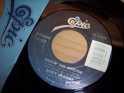 VG+ 1986 Ricky Skaggs Rasin' The Dickens/Wonder If I Care As 7" 45RPM w ...