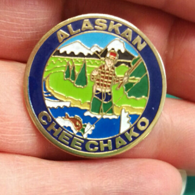 Alaska Pin - Alaskan Cheechako round hat lapel pin with a guy fishing ...