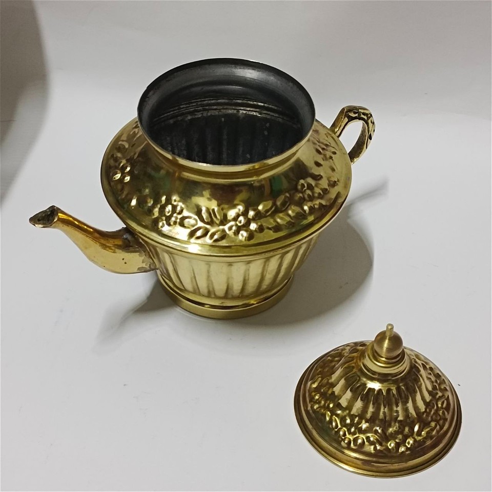 Vintage brass teapot with ornate detailing classic antique décor ...