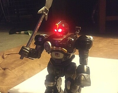 Light Up Red Eyes Toy Robot ,complete with weapon and batteries inside ...
