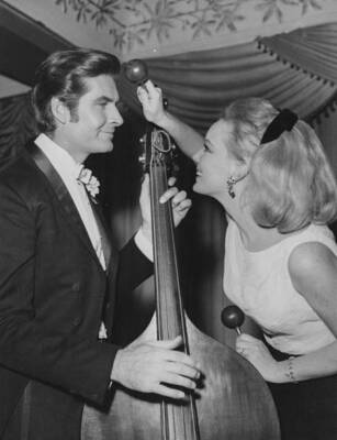 Magician Channing Pollock playing a double bass & actress Edy V- 1962 ...