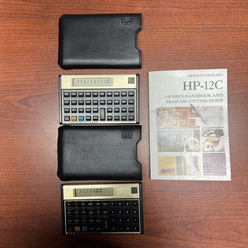 lot 2 HP 12C financial calculator with sleeves and 1 manual both are ...