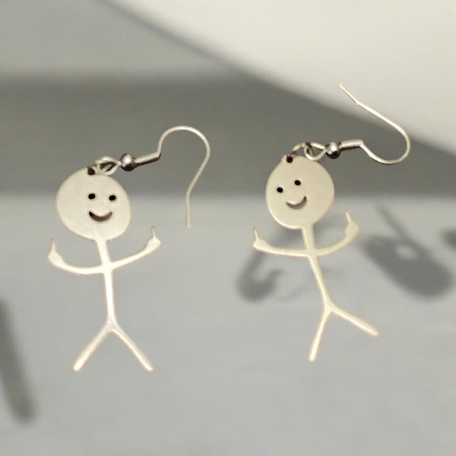 Silver Tone Stick Figure earrings shooting bird middle finger 2” Dangle ...