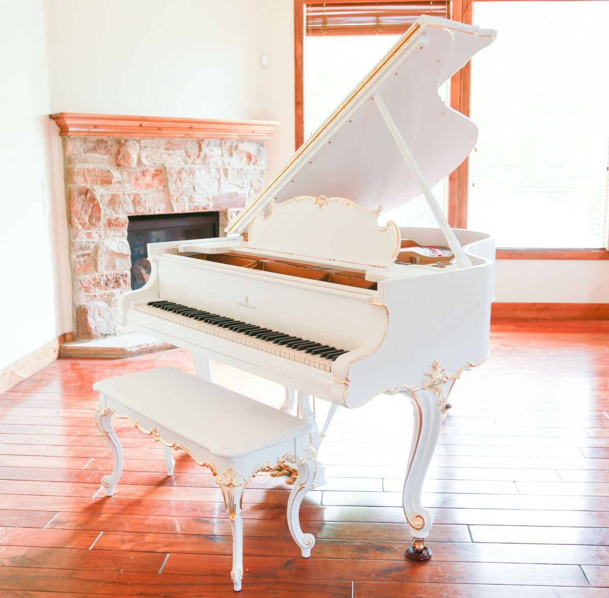 White Steinway Baby Grand Piano
