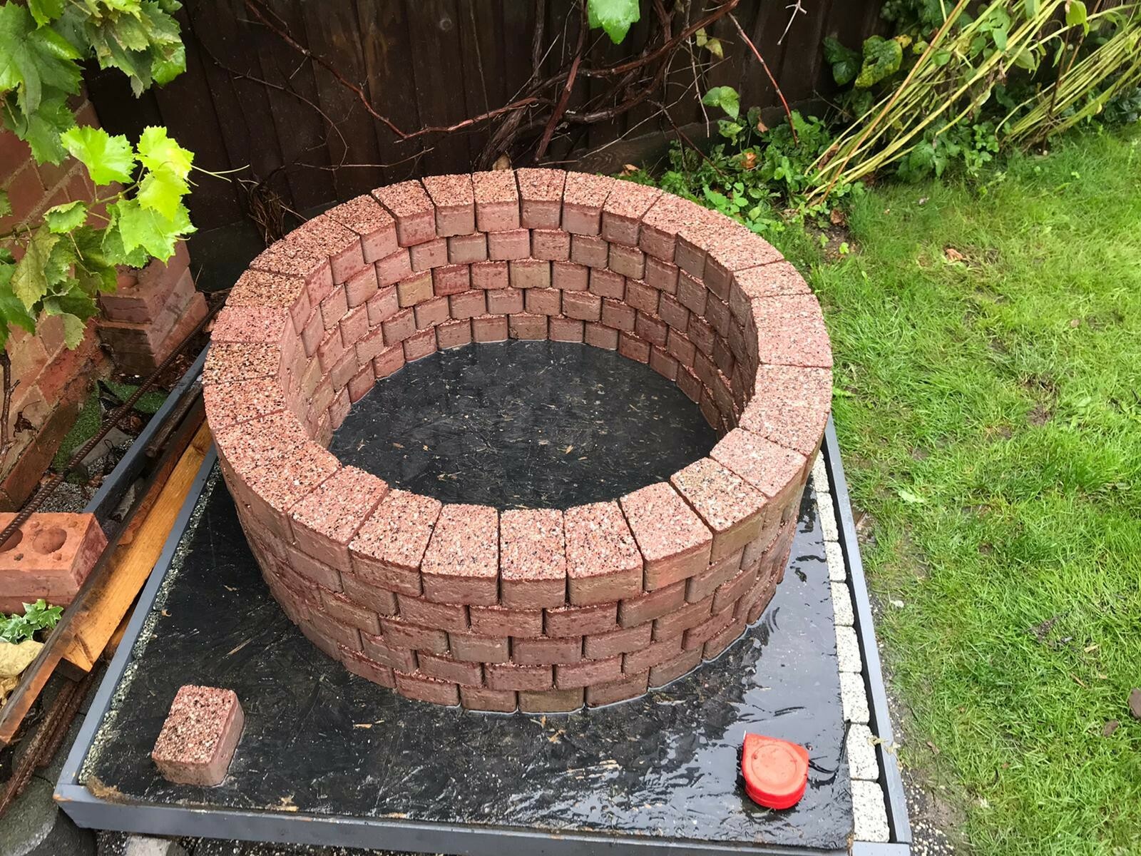 rounded fire pit kit brick Fireplace concrete stones log burner wood ...