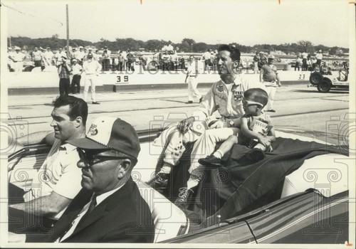 1966 Press Photo Mario Andretti takes son Michael on victory lap in ...