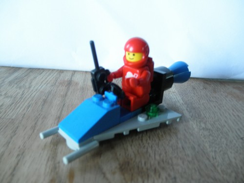lego red spaceman with red laser gun and space shipwith front gun and ...