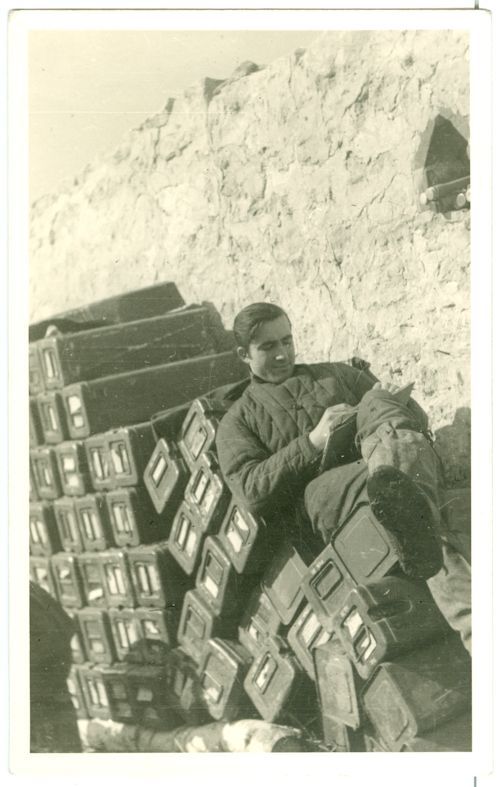 German soldier resting on a pile of 5cm Pak.38 ammo boxes, WW2 ...