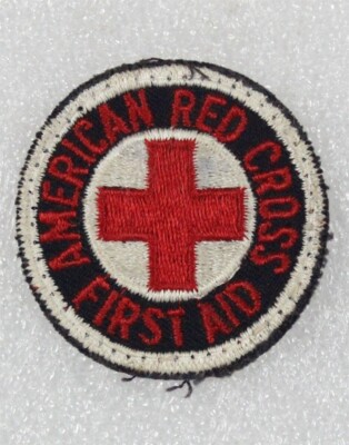 Red Cross: First Aid patch, 2" round w/red letters on black, cut edge ...