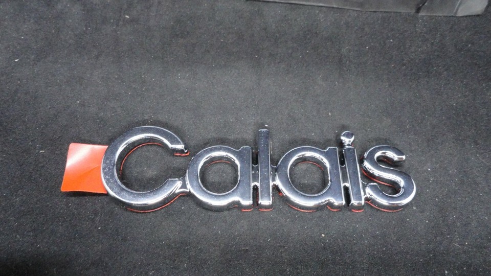 NOS 1988-91 OLDSMOBILE CUTLASS CALAIS 2 DOOR DOOR NAMEPLATE EMBLEM ...