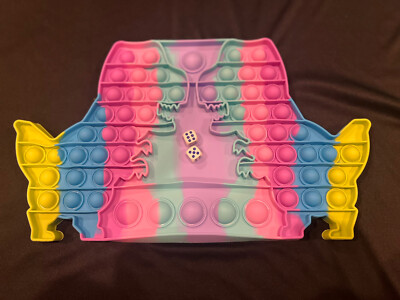 Pop it Fidgit Dinosaur game with mini dice. sealed in original package ...