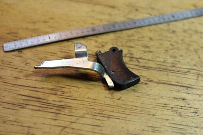 Lorcin L22 22 l/r used Pistol Part, Trigger w/ Bar & Spring .black #6. | eBay