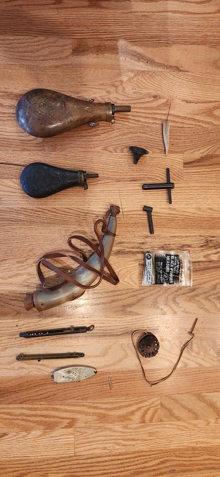 Two black powder flasks, powder horn, cappers, wrenches, a measure and ...