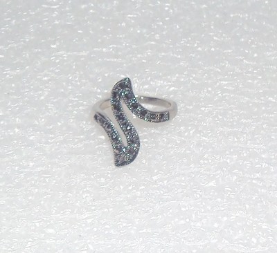 Metal ring with S-like design, decorated with an intricate design of ...