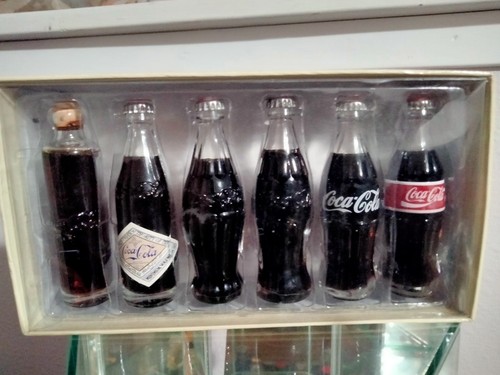 A set of Miniature Coke bottles, still in box. Very Cute and ...