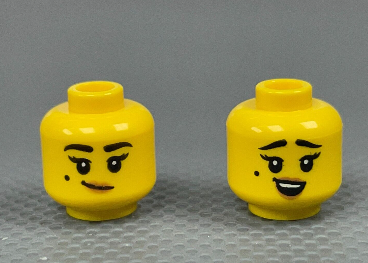 LEGO Female Minifigure Head Black Eyebrows Beauty Mark Lopsided Grin ...