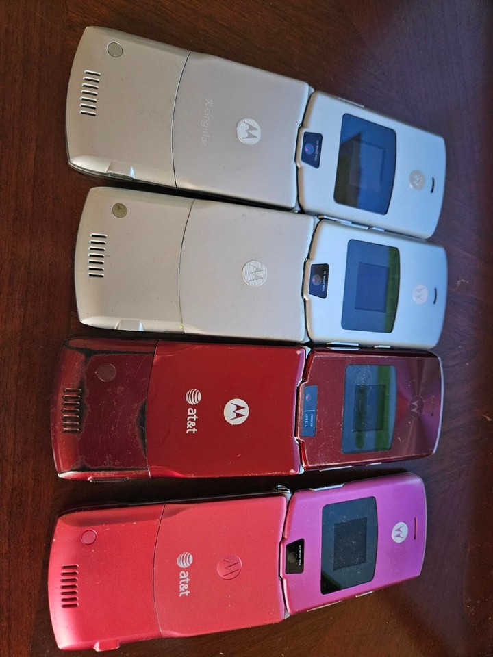 Four used Motorola Razr phones - 2 silver, 2 red - all worked before ...