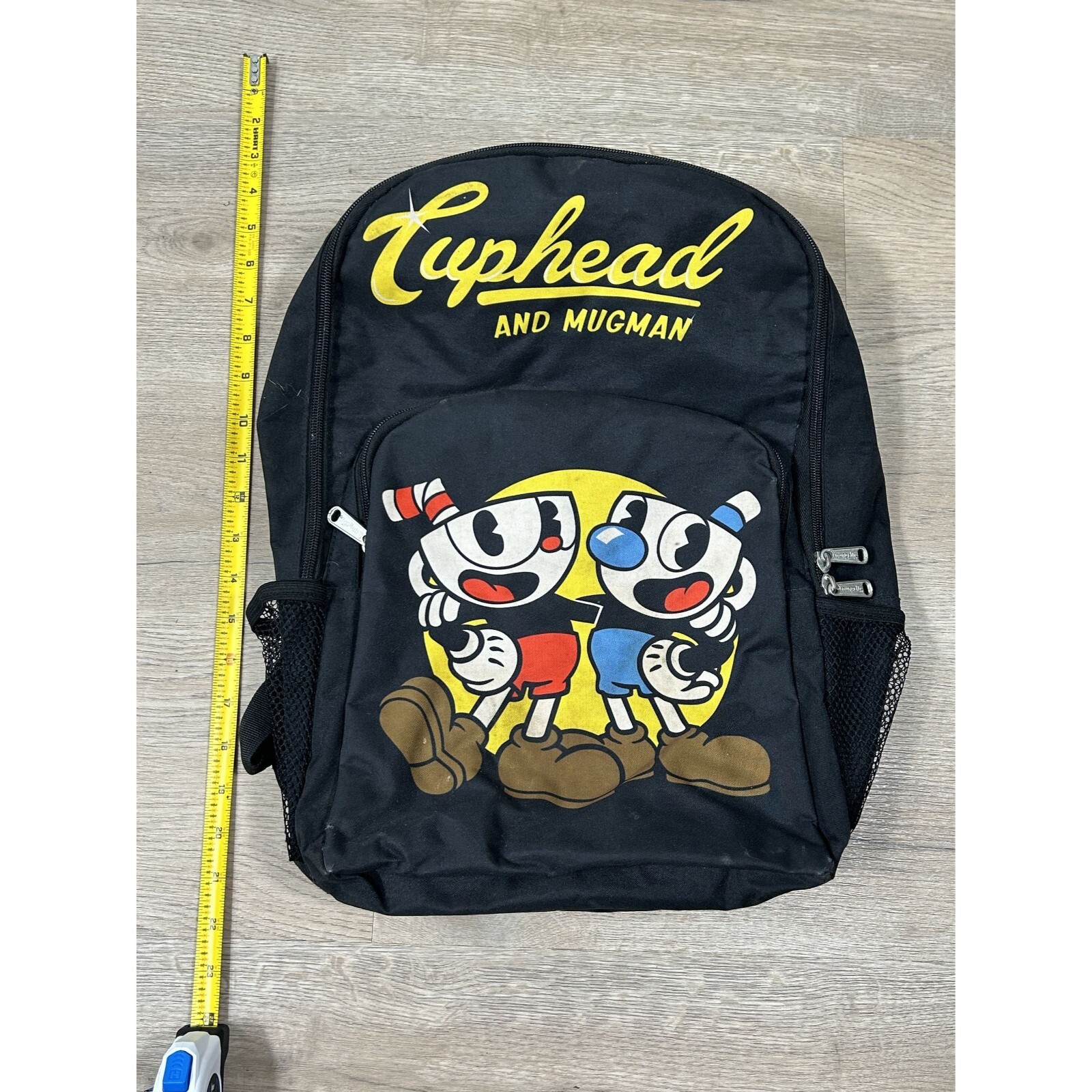 Cuphead And Mugman Black Promotional Graphic Backpack… - Gem