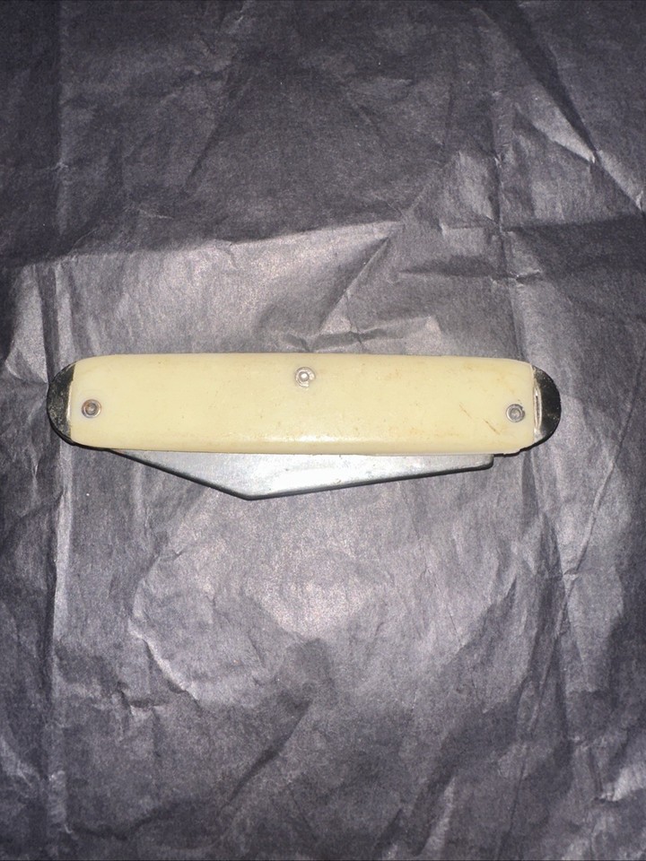 vintage Smith & Wesson pocket knife with a cream handle and blue logo ...