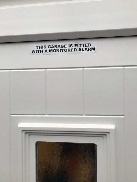 THIS GARAGE IS ALARMED SECURITY DETERRENT. MONITORED 24/7 STICKER SIGN ...